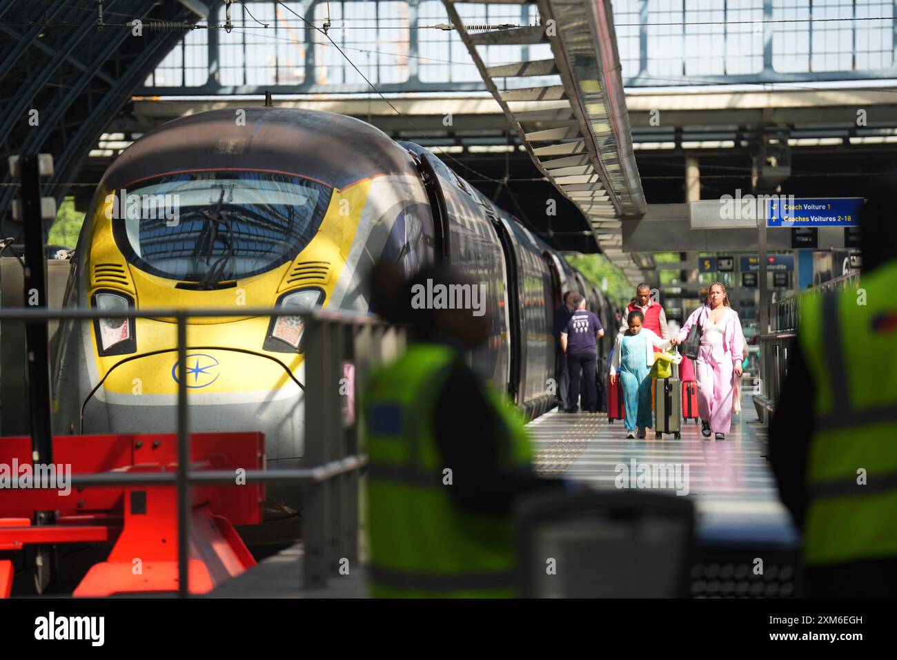 Passengers arrive by train at the Eurostar terminal at St Pancras ...