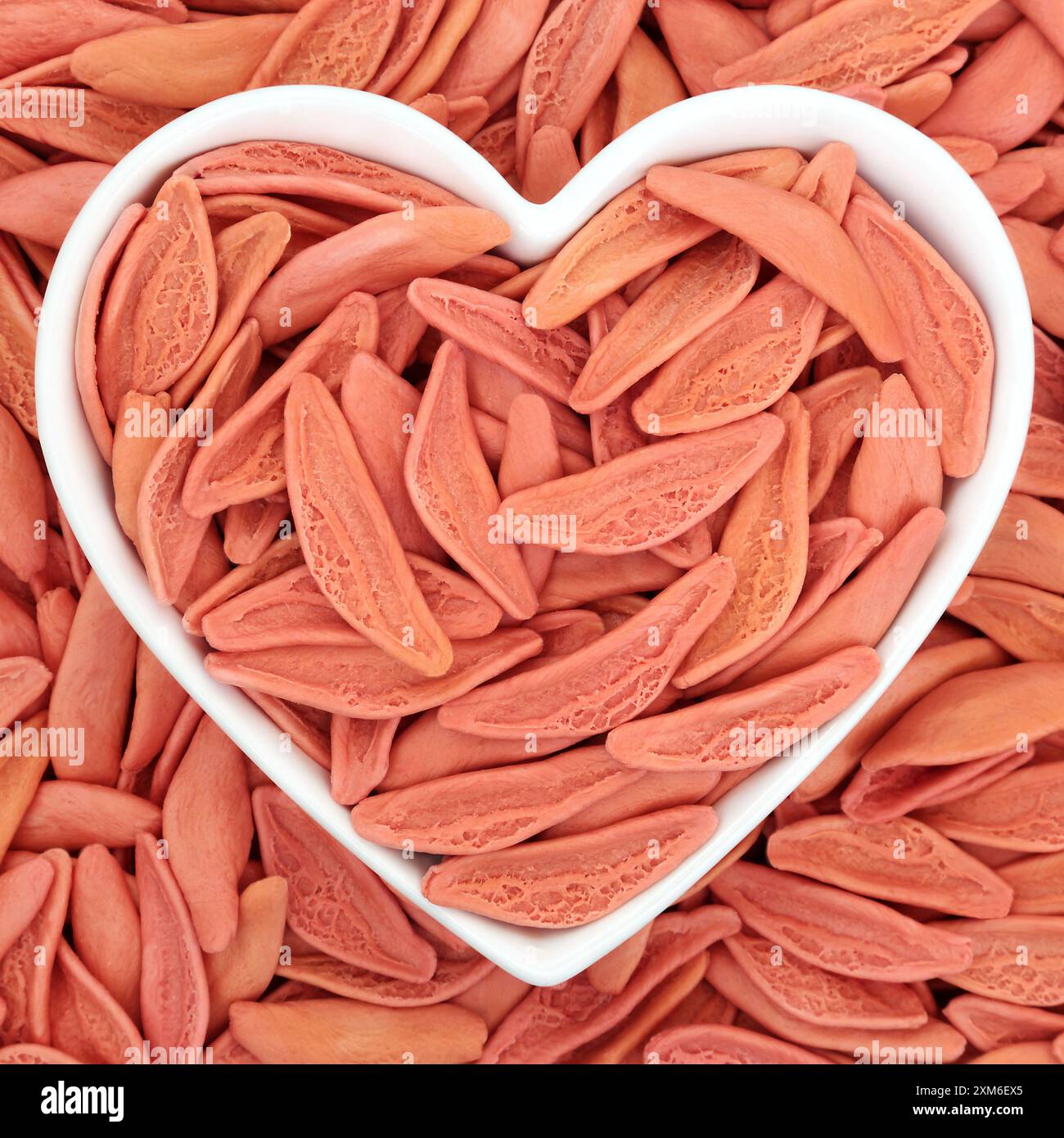 Italian foglie D'ulivo pasta background with heart shape dish. Dried ...