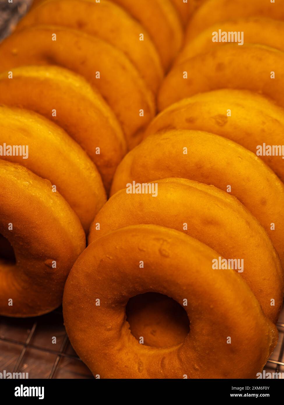 A close-up of a stack of freshly baked glazed donuts Stock Photo - Alamy