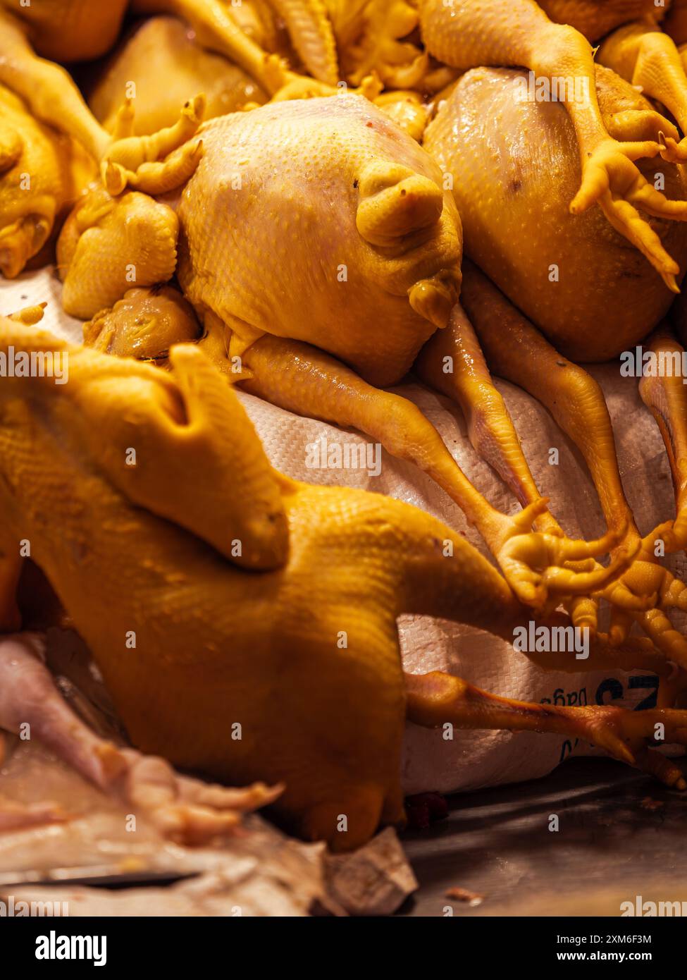 A close-up view of several whole chickens at a market stall Stock Photo ...