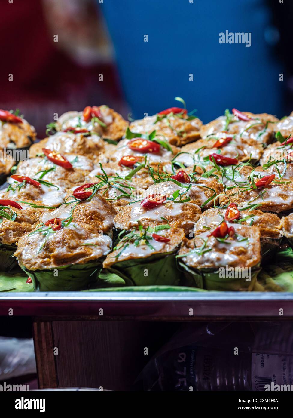 A close-up view of a tray of steaming fish cakes Stock Photo - Alamy