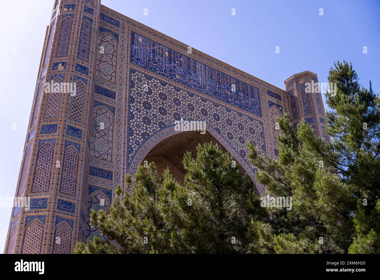 A blue and white building with a blue archway Stock Photo - Alamy