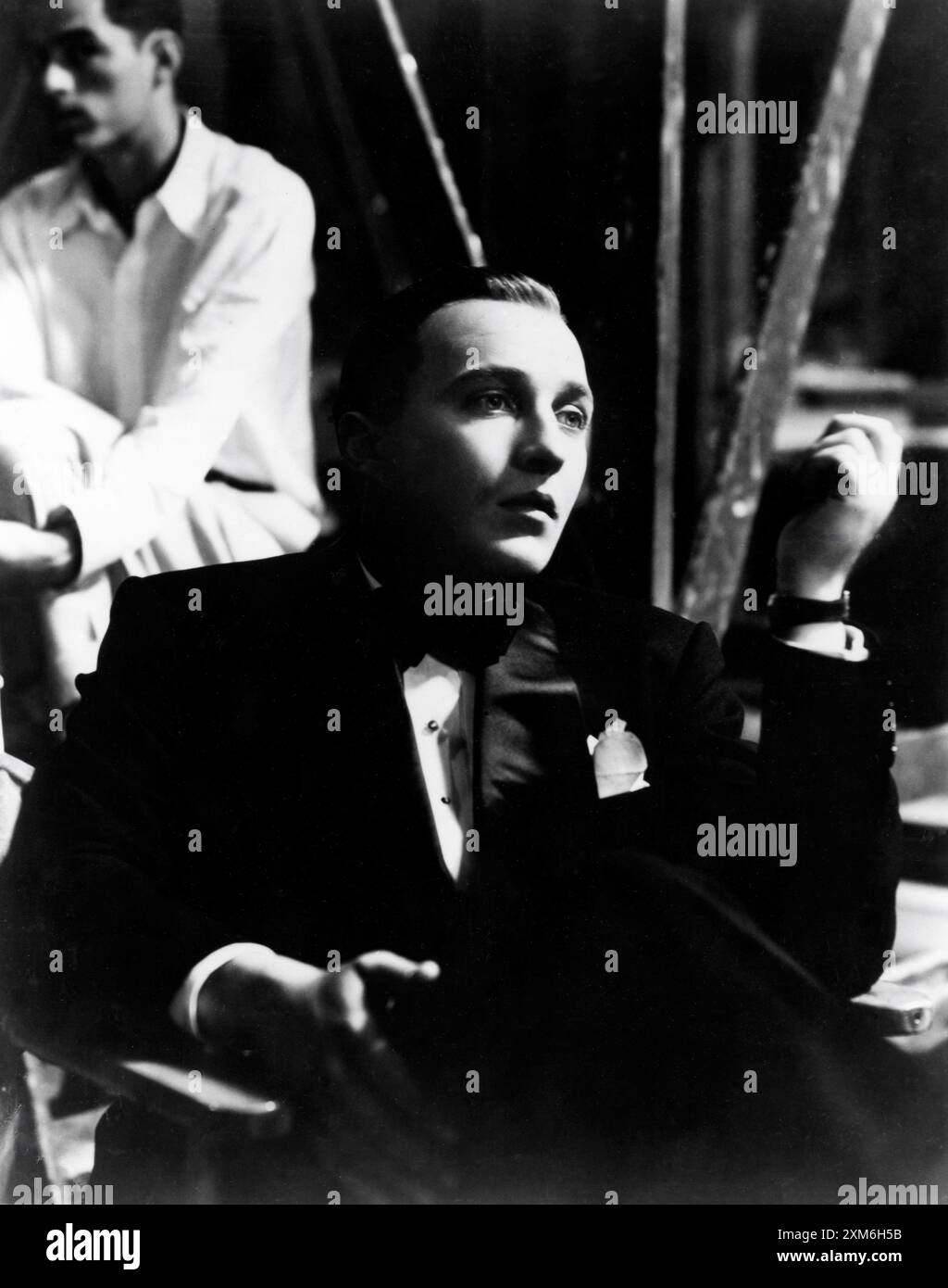 BING CROSBY on set candid relaxing between takes during filming of TOO ...