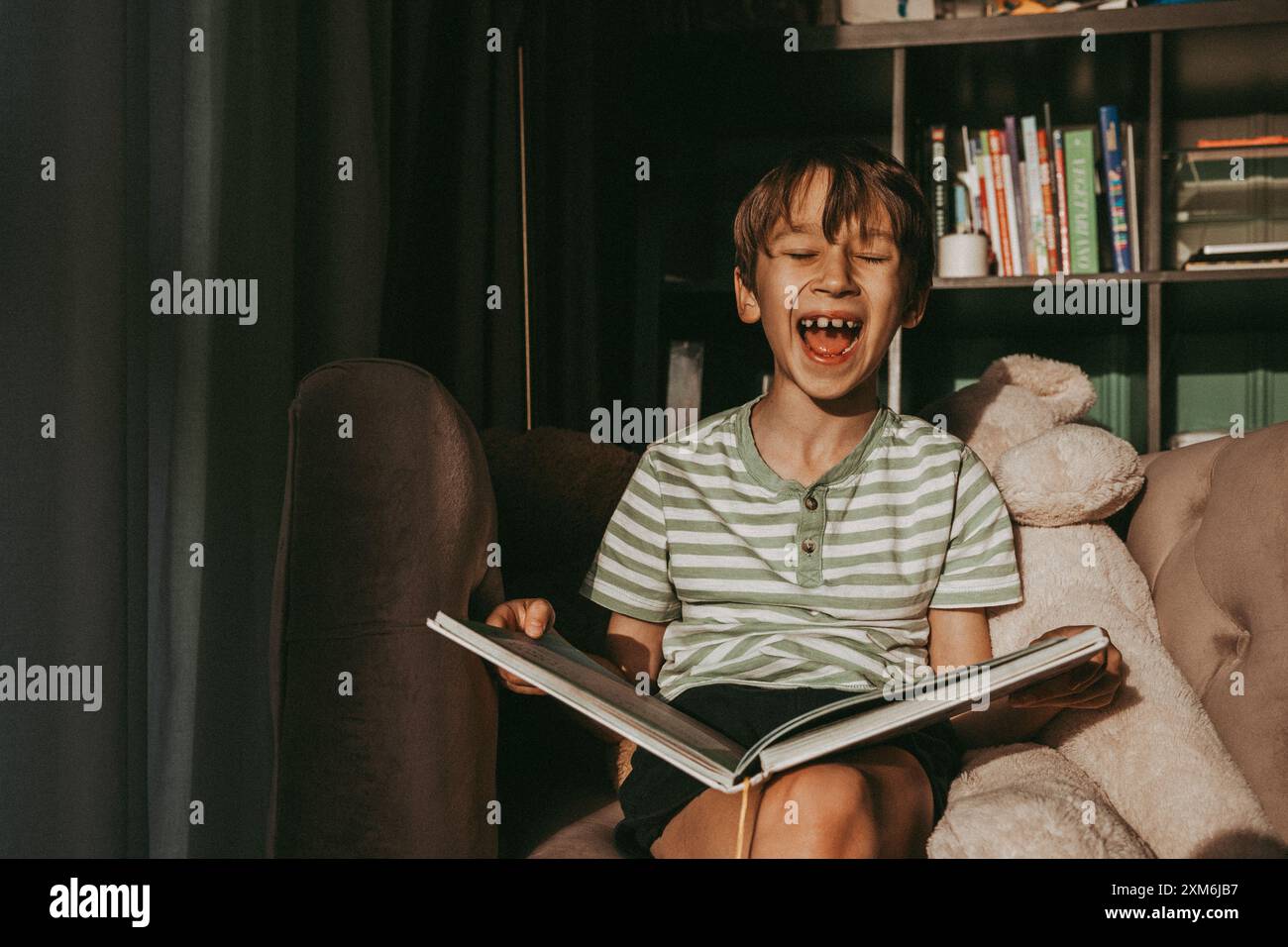 Schoolboy reading book hi-res stock photography and images - Alamy