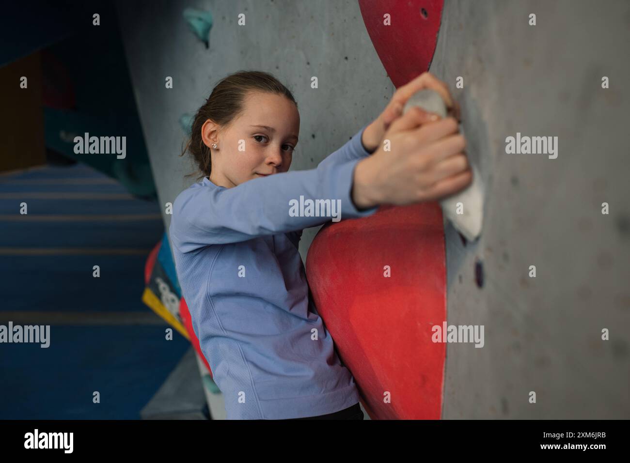 portrait of a child bouldering at an indoor climbing centre Stock Photo ...