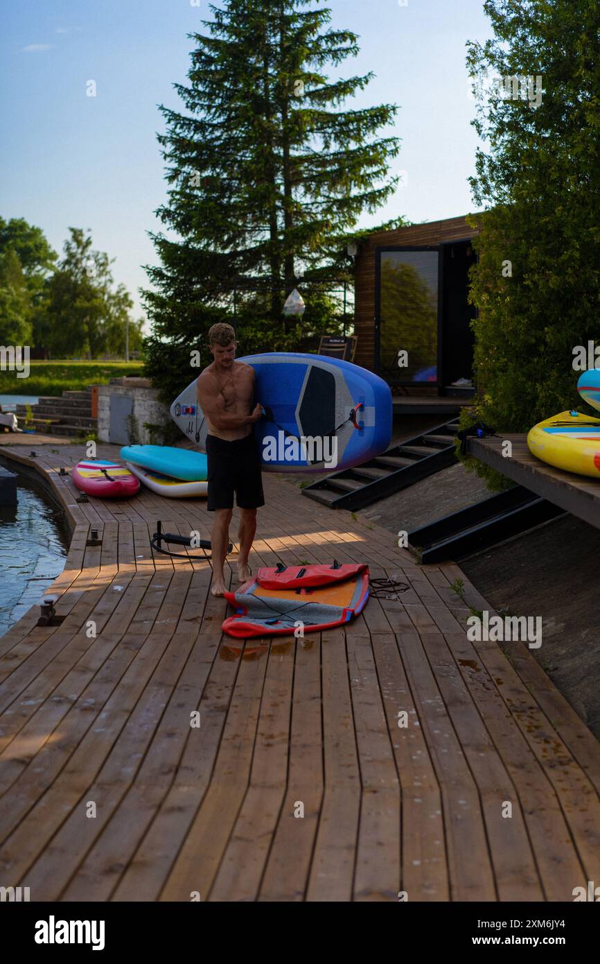 Man paddling on sup board hi-res stock photography and images - Alamy