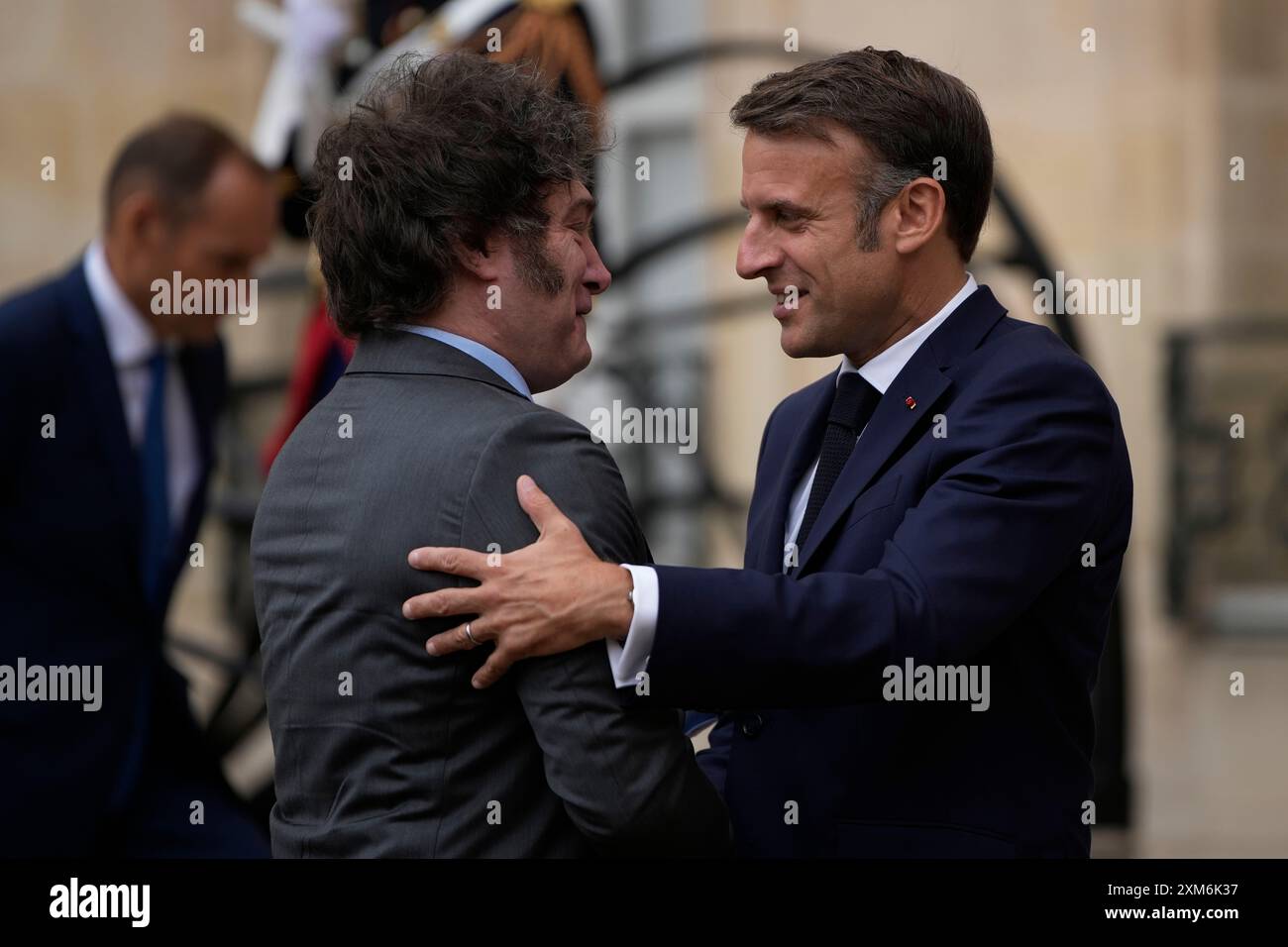 French President Emmanuel Macron, right, welcomes Argentina's President ...