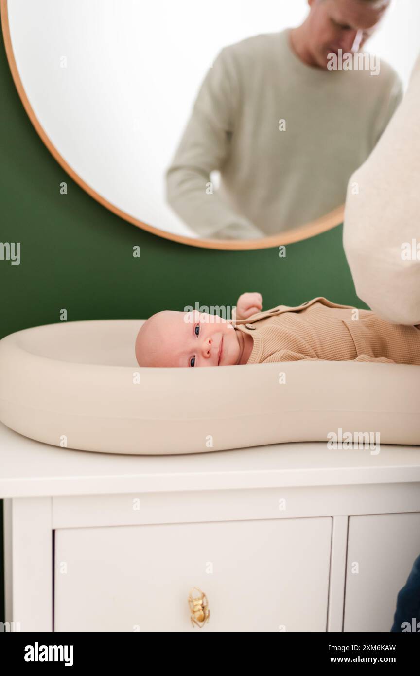 Father taking care of infant hi-res stock photography and images - Alamy
