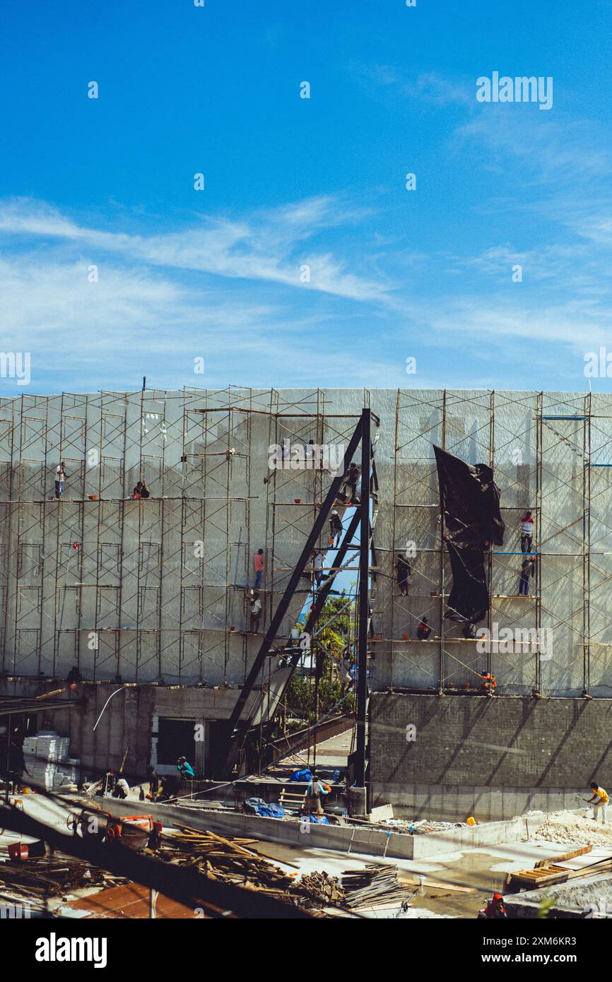 Construction workers working on construction site Stock Photo - Alamy