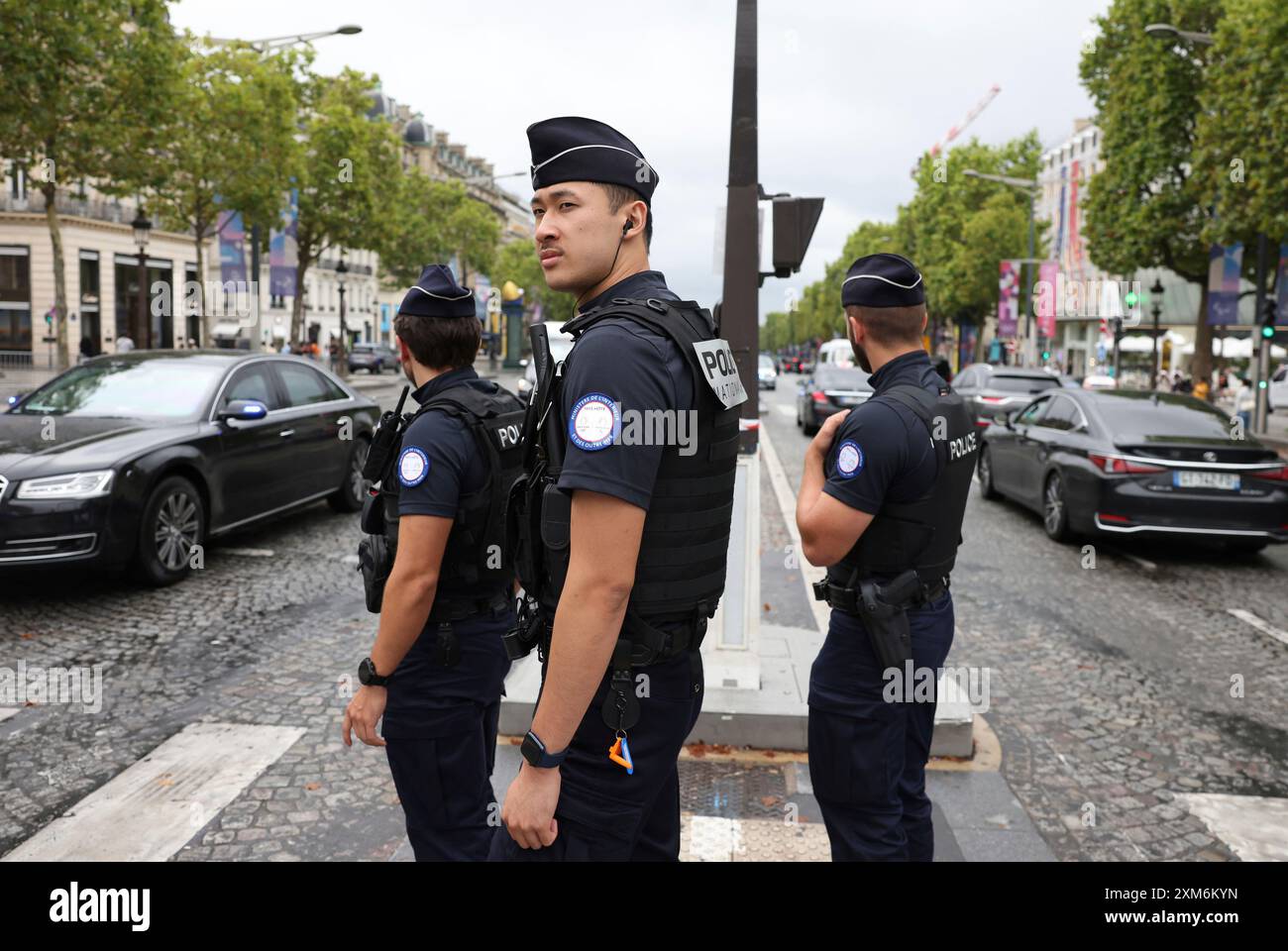 Police officers patrol on the Avenue des Champs-Élysées in Paris on ...