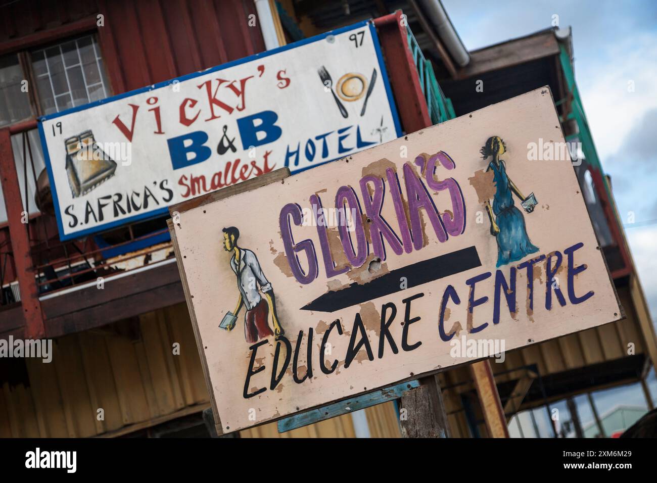 The signs of Vicky's Bed and Breakfast and Gloria’s Educare Center in a ...