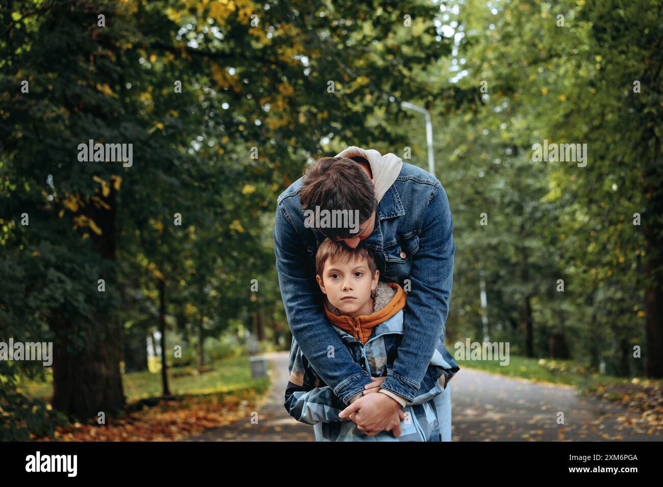 Dad hugging sad child hi-res stock photography and images - Alamy