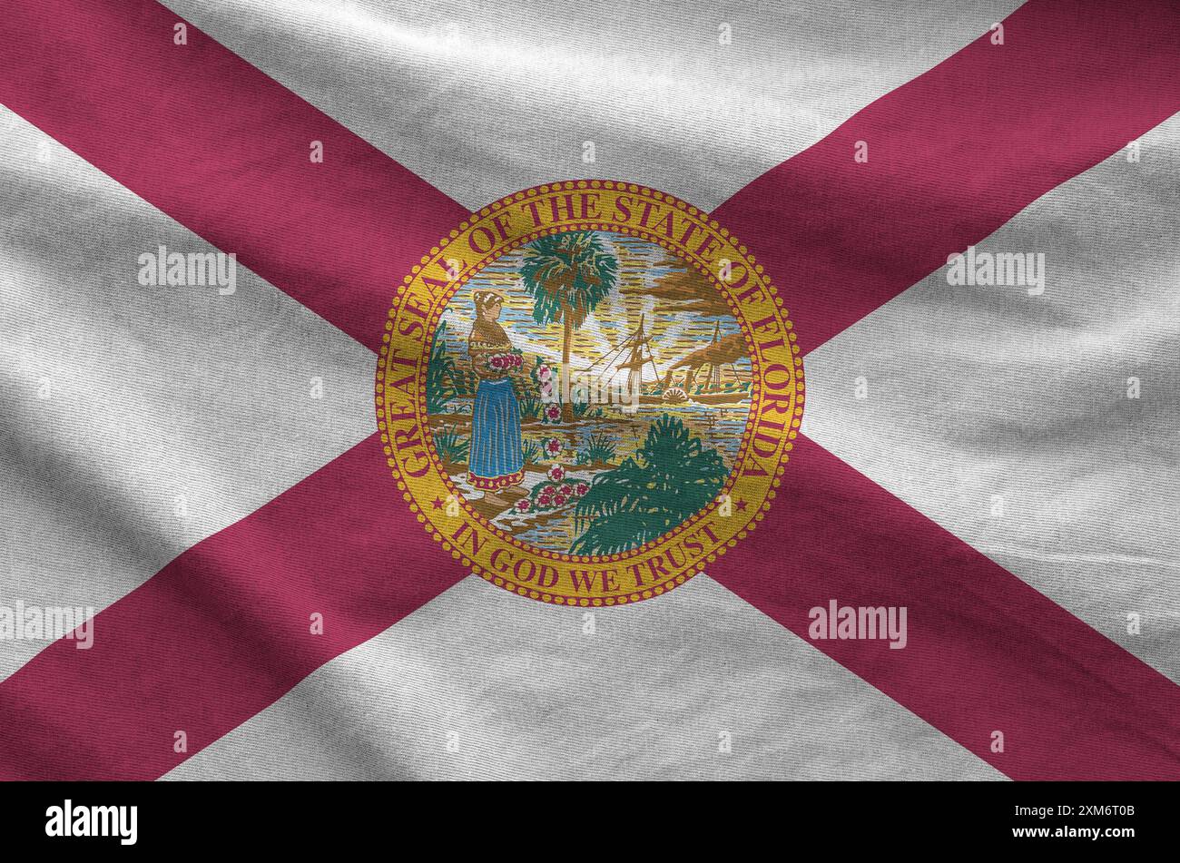 Florida US state flag depicted on folded wavy fabric of old cloth close ...