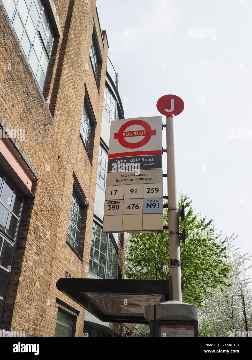 A bus stop in London showing the London transport roundel, location of ...