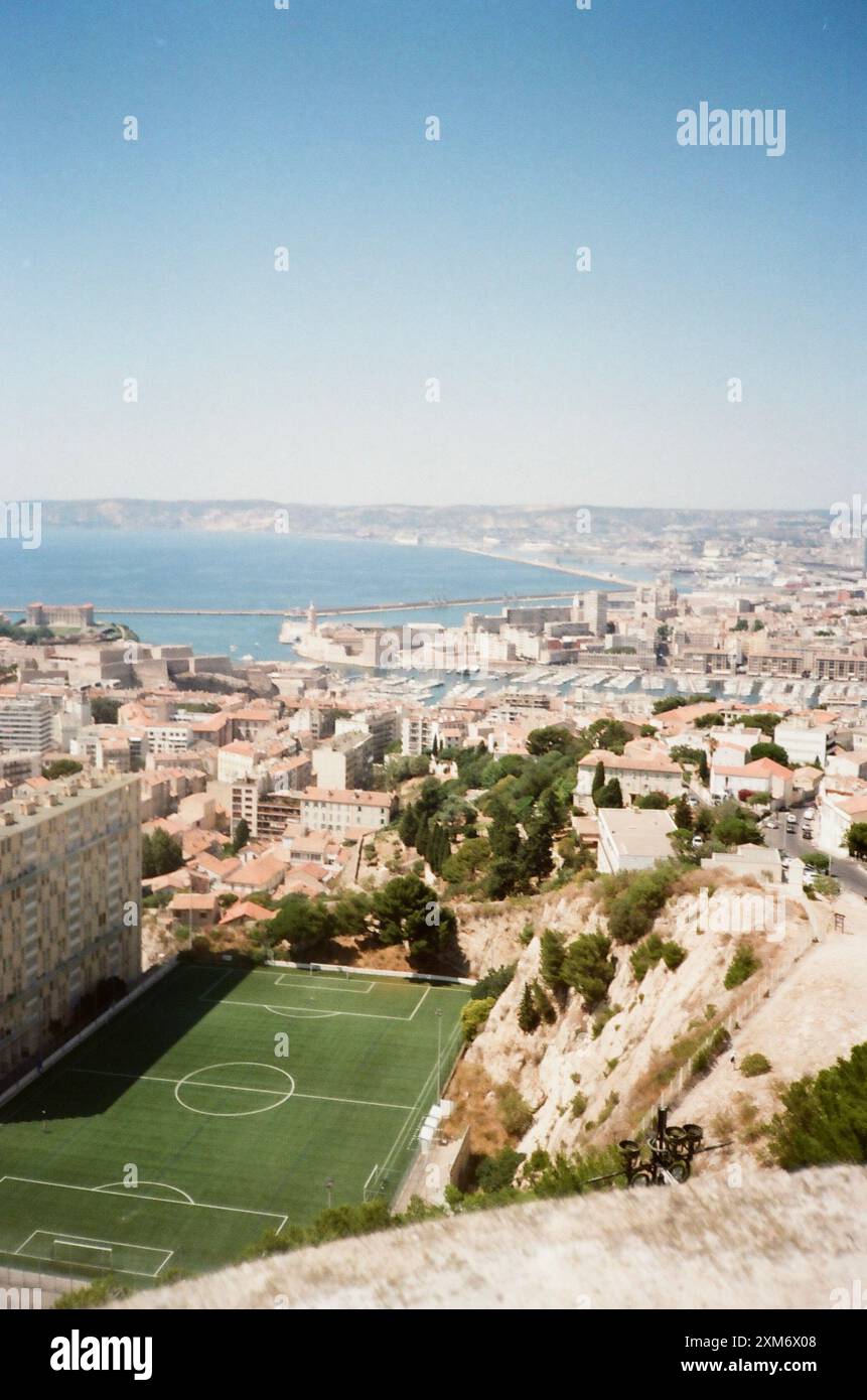 Cityscape surprise: a football field nestled amidst the urban landscape ...