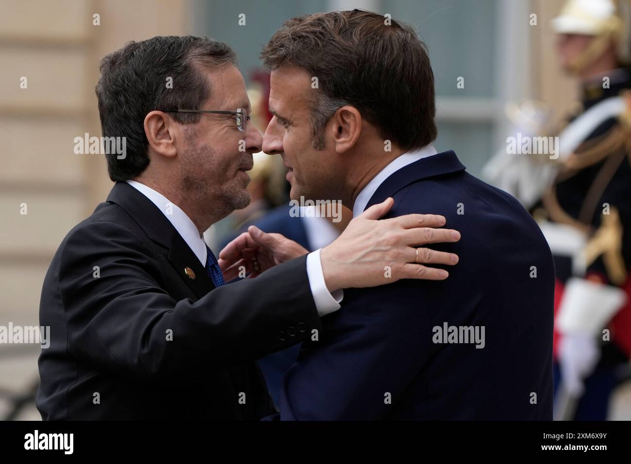 French President Emmanuel Macron, right, welcomes Israeli President ...