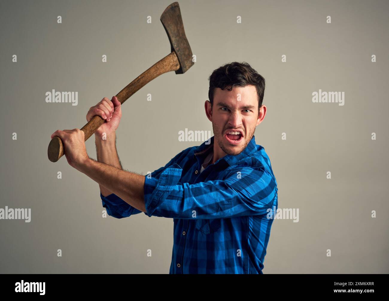Angry, studio and portrait of man with axe for aggressive, screaming ...