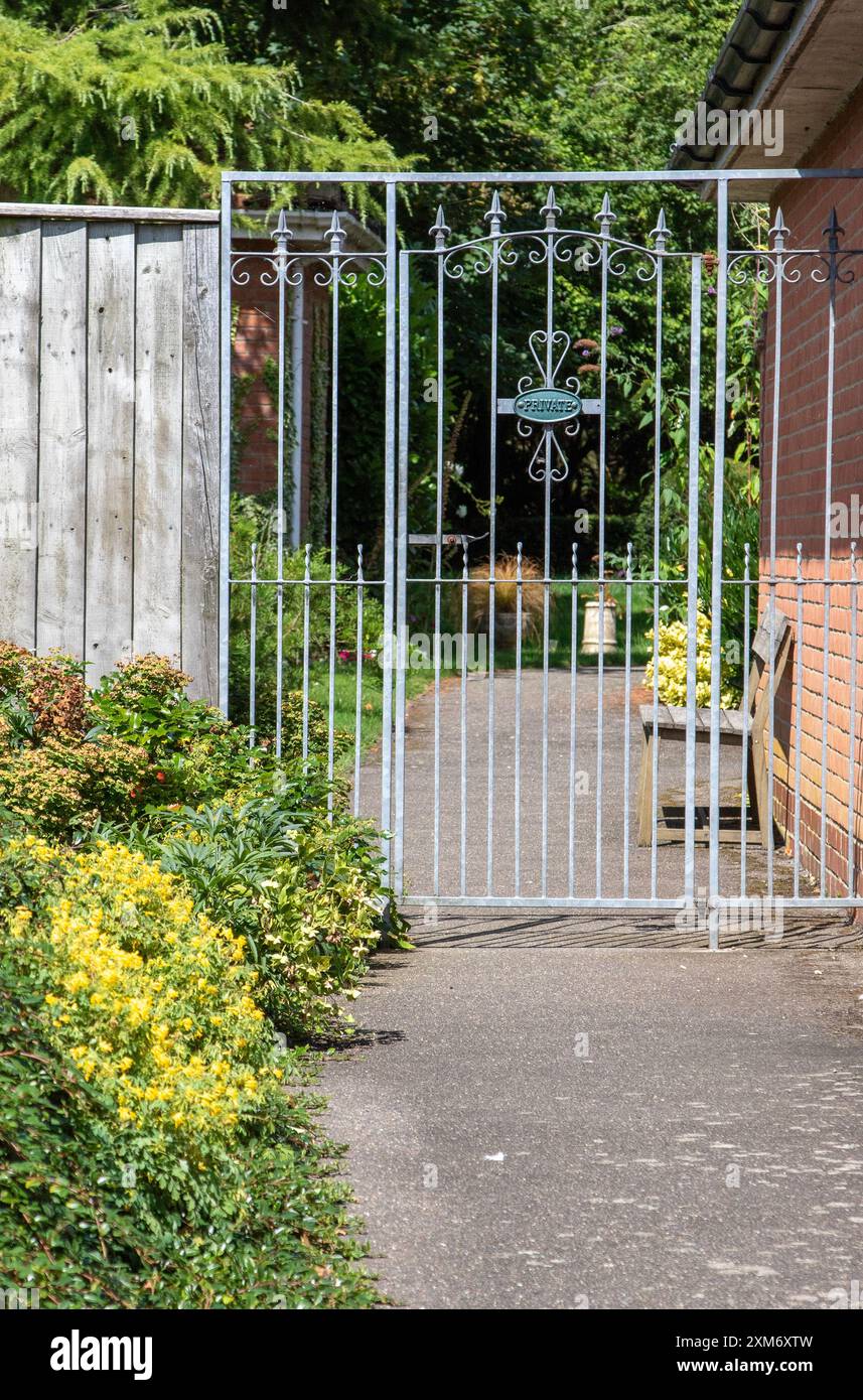 Attractive decorative metalwork gate/door marks a clear boundary at the ...