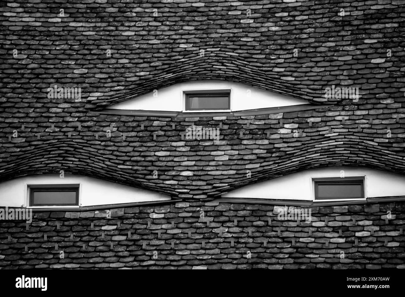 Charming rooftop in Sibiu, Romania, featuring the iconic 'eyes' windows ...