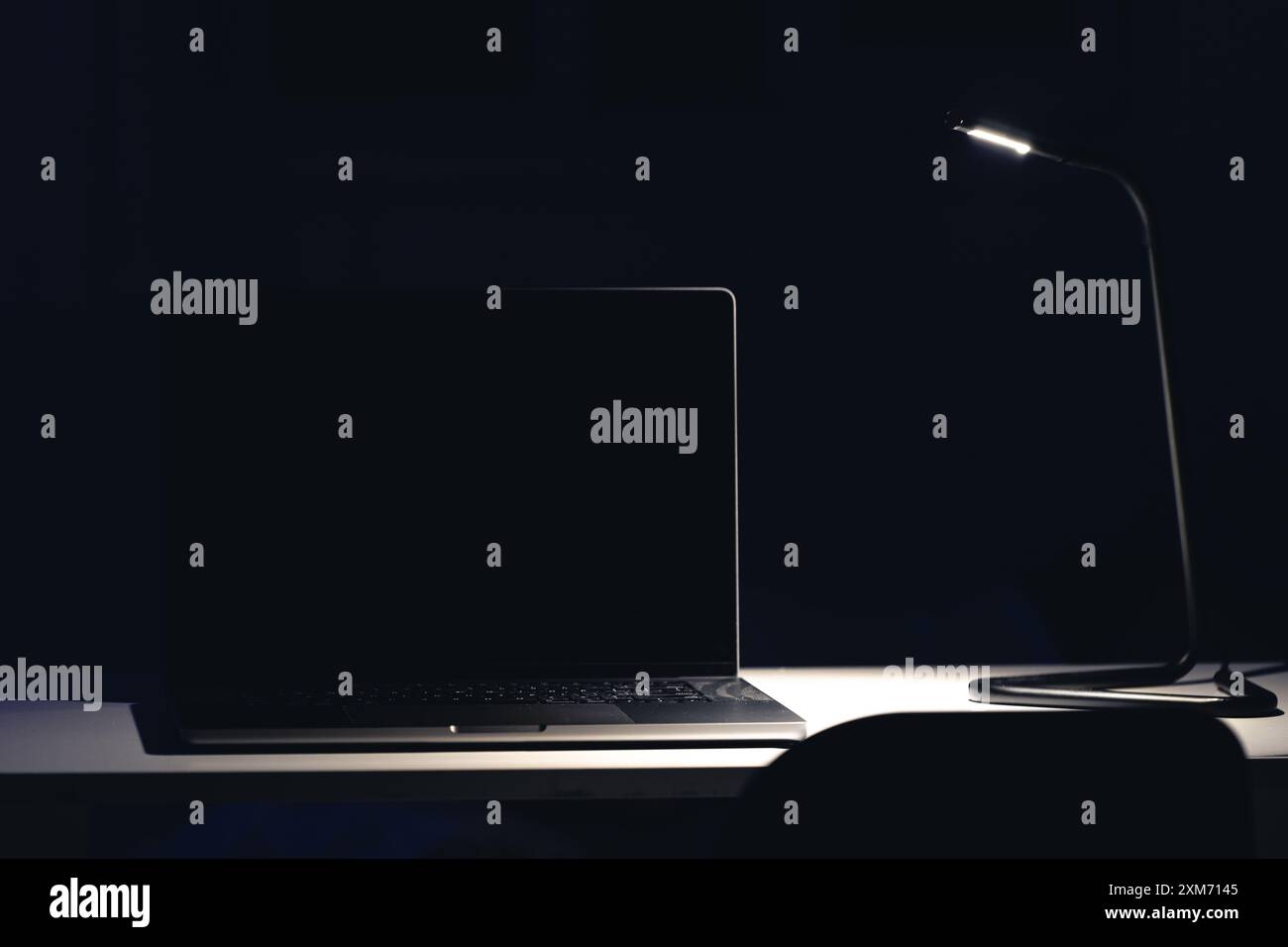 Black laptop screen in a dark room at night Stock Photo - Alamy