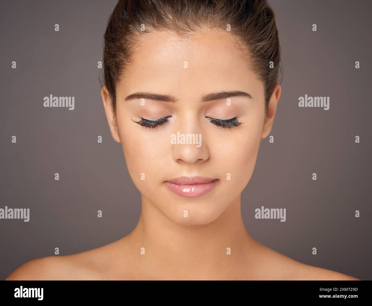 Smile, eyes closed and woman with makeup on studio background for ...