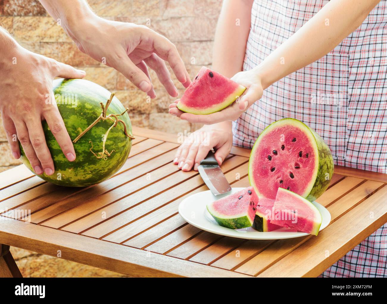 Young woman slicing sweet red hi-res stock photography and images - Alamy