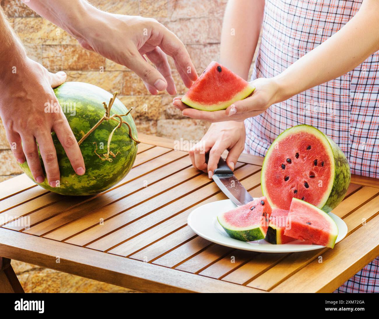 Slicing watermelon knife hi-res stock photography and images - Alamy