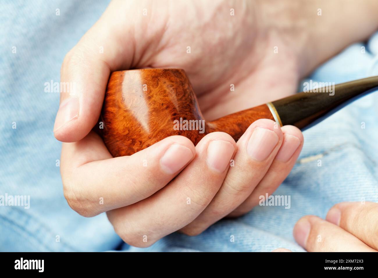 Hand holding pipe hi-res stock photography and images - Alamy