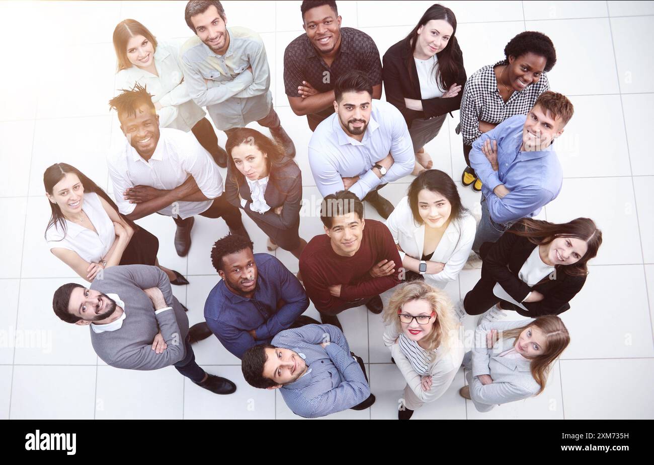 large group of diverse young people looking up hopefully Stock Photo ...