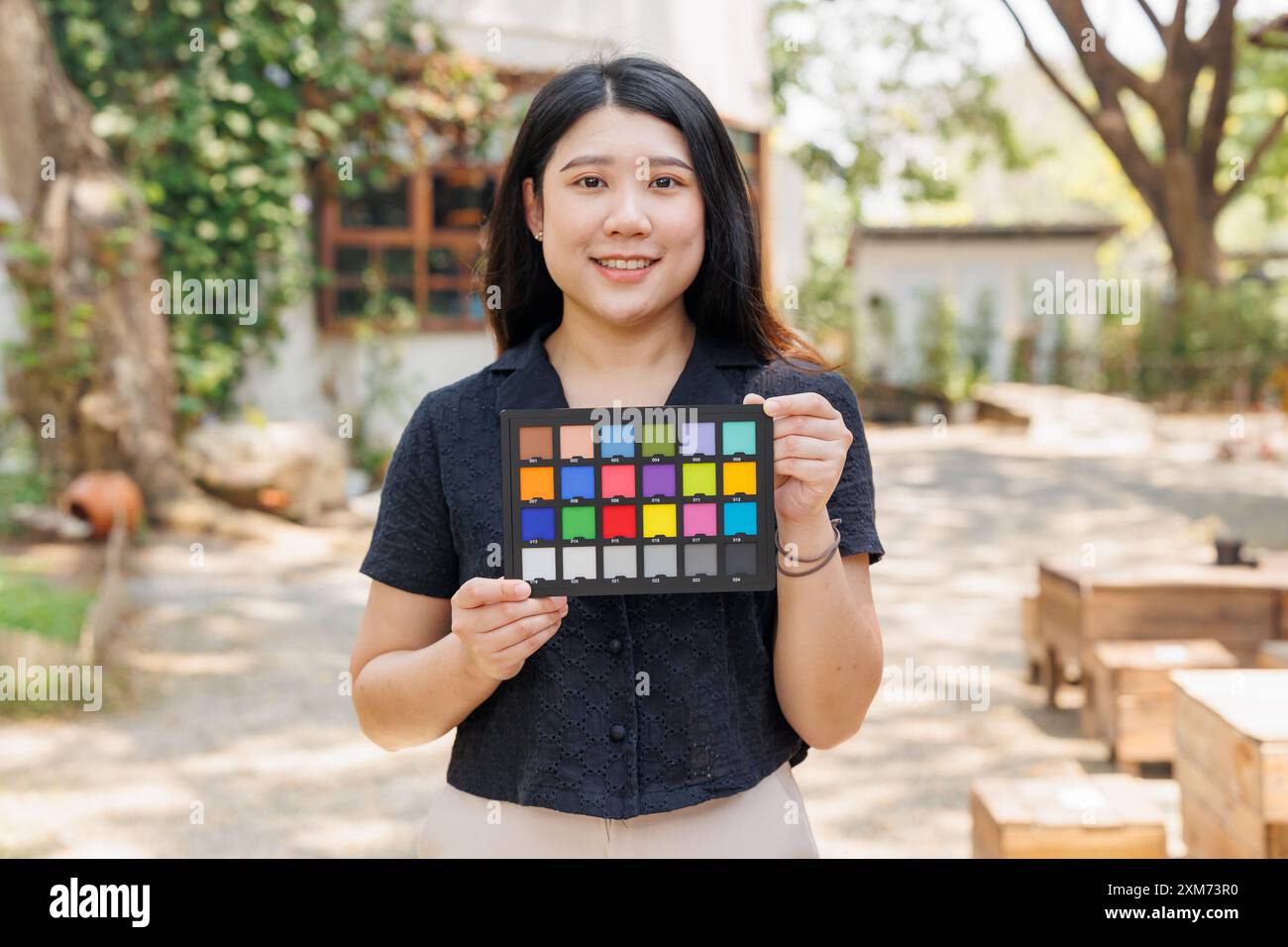 Model holding colors checker board, Colour accuracy marker tile, Colors ...