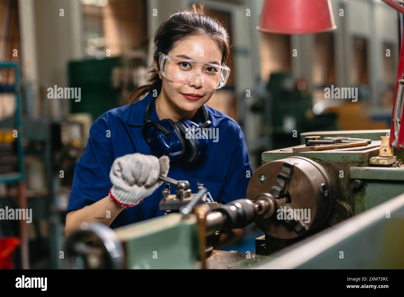 Portrait happy engineer worker with safety eyes protection glasses ...