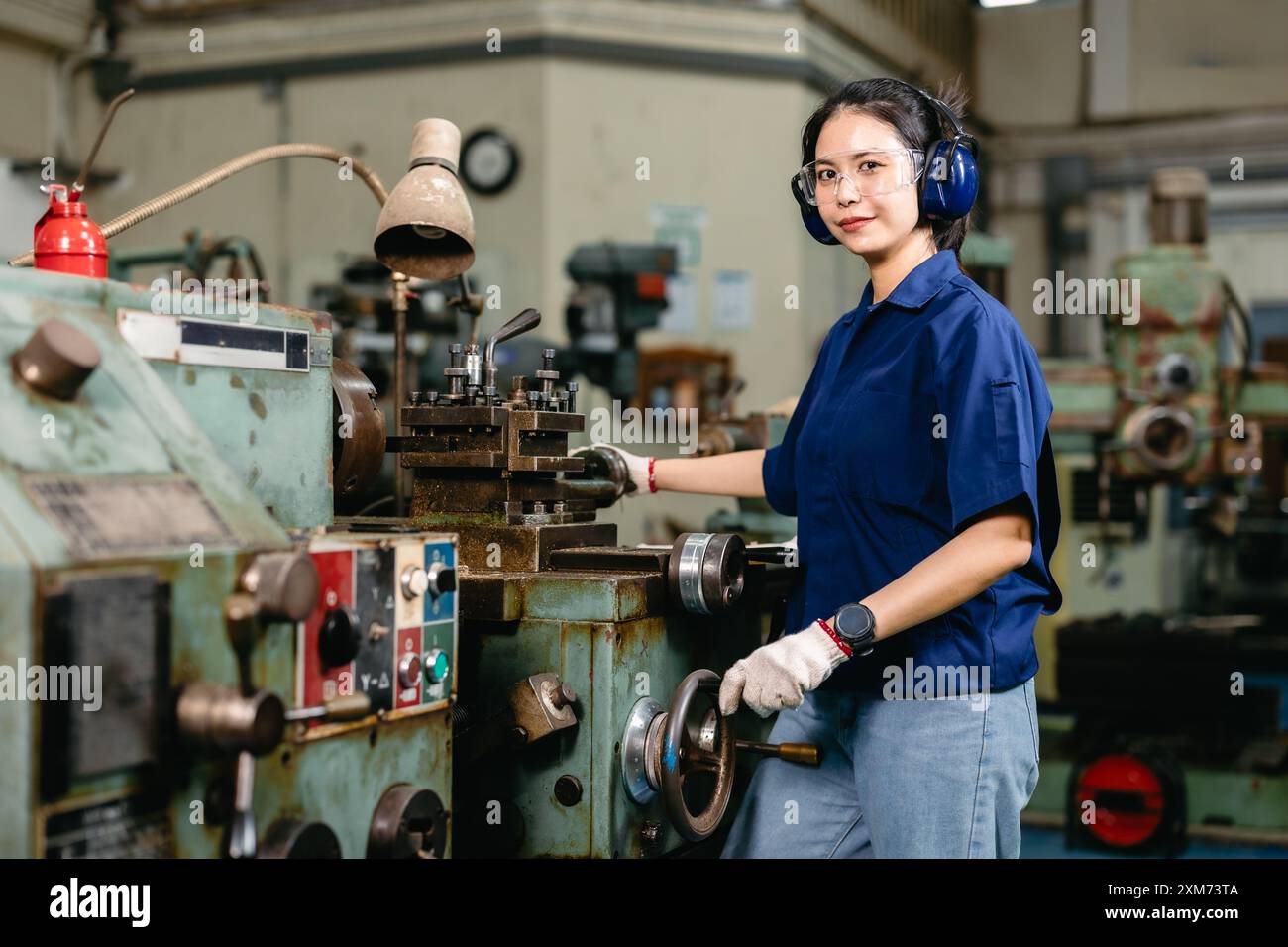 Portrait happy engineer worker with safety eyes protection glasses ...