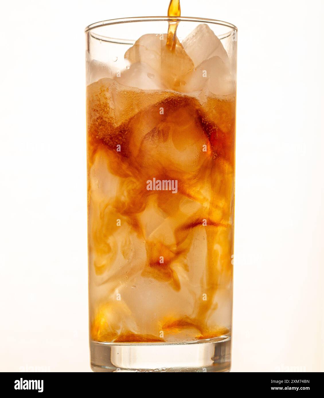 Pouring coke in glass with ice hi-res stock photography and images - Alamy