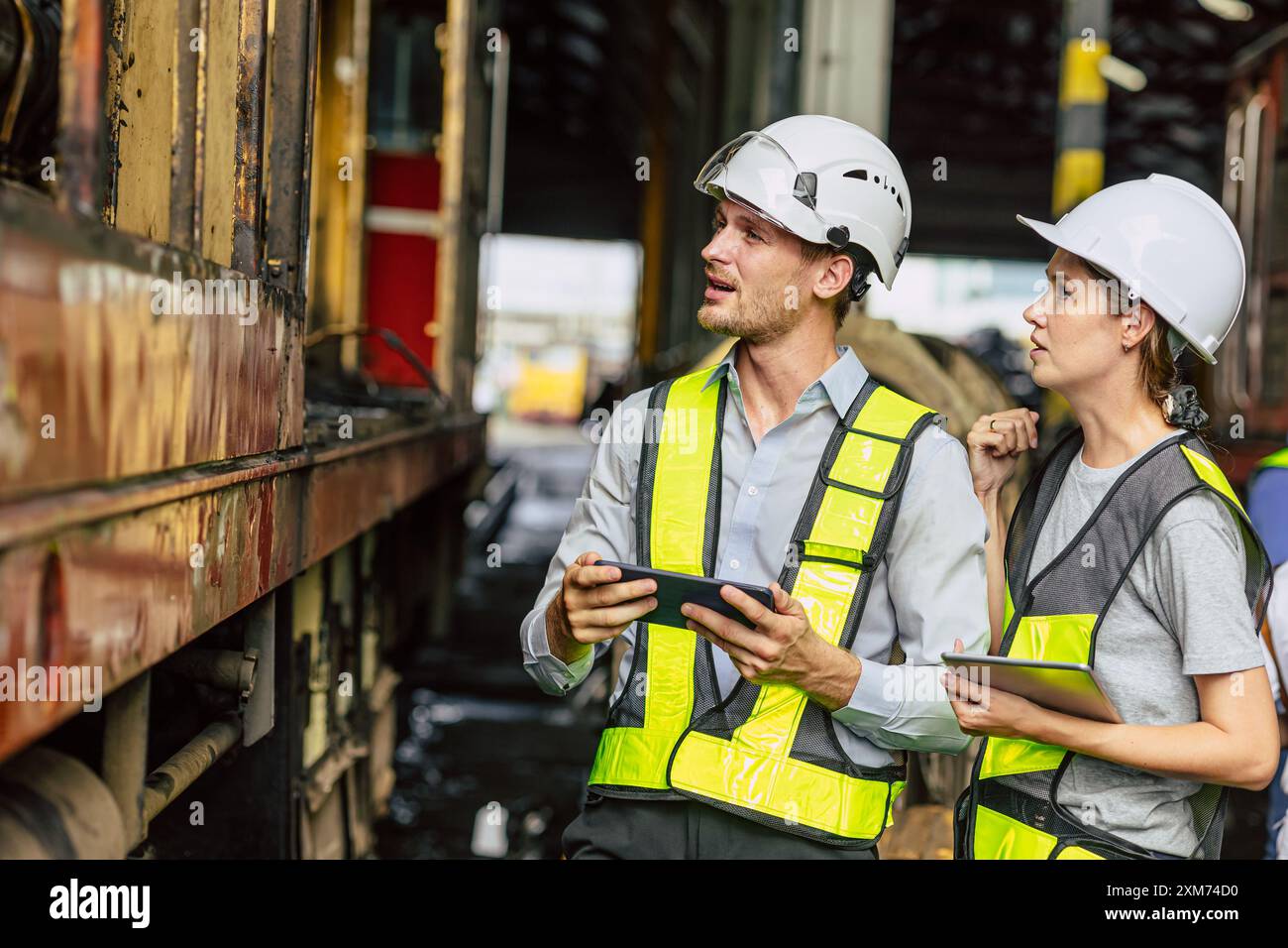 Engineer train engine service team man and women working together at ...