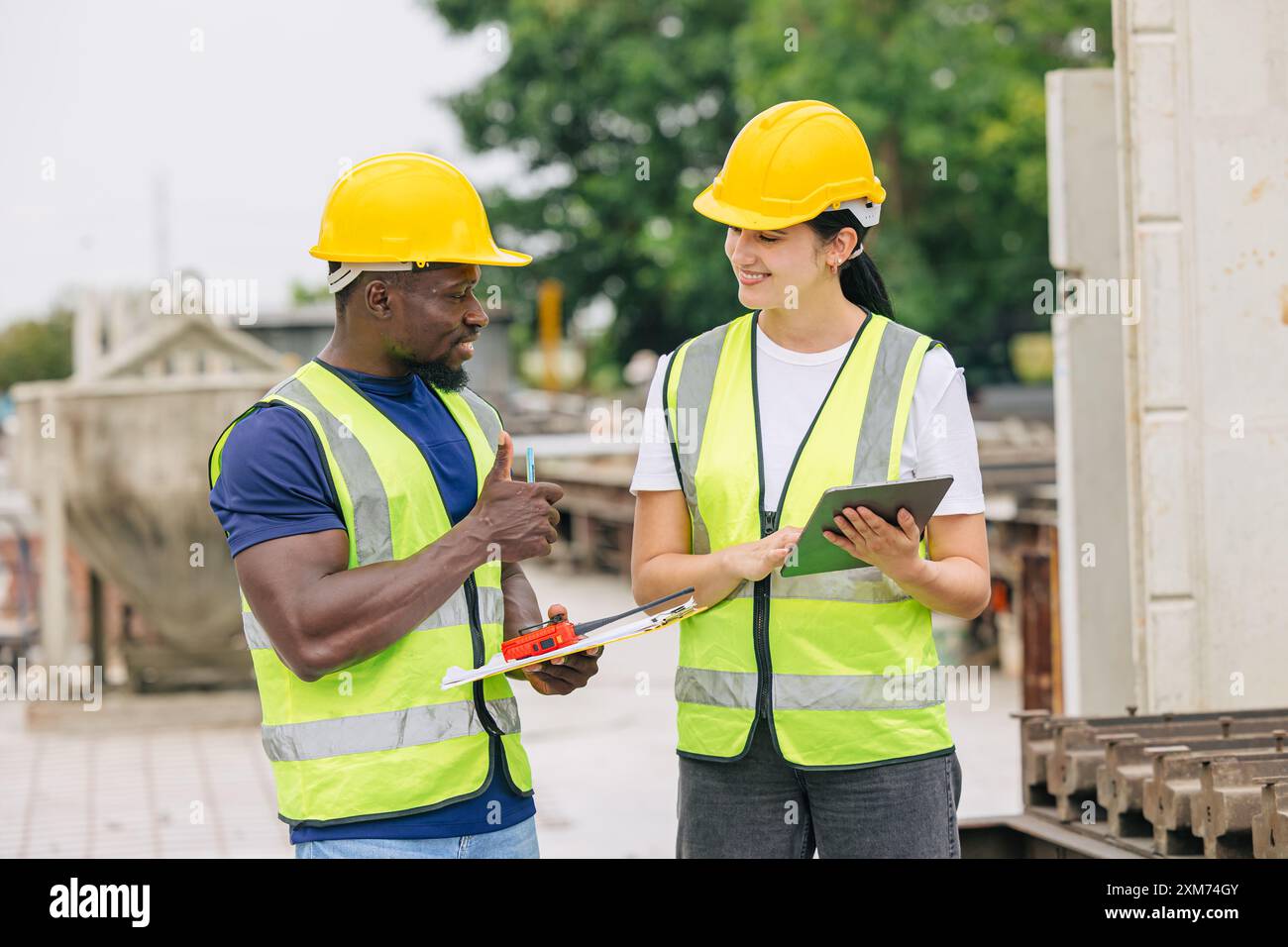 Engineer smart women working contact with African black worker in ...