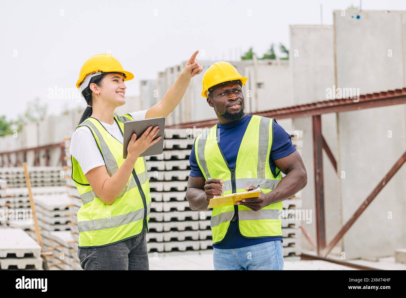 Engineer smart women working contact with African black worker in ...