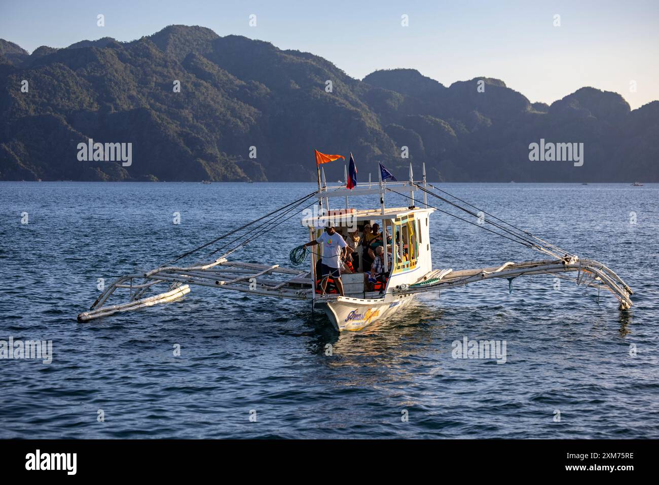 Bangka outrigger canoe tour boat and coast, Coron, Palawan, Philippines ...