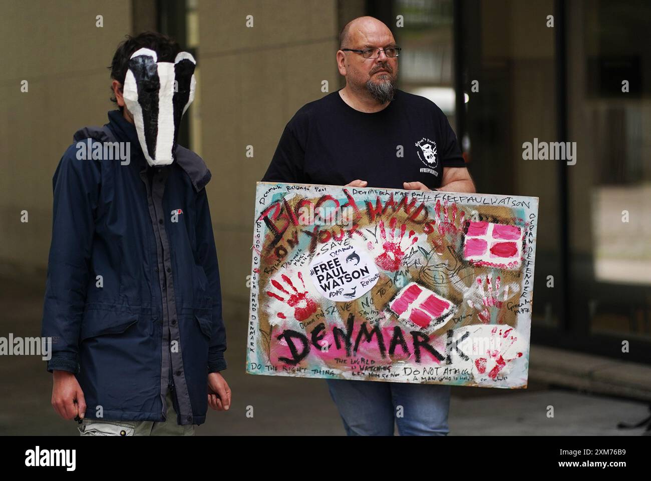 Alex Neubauer (right) of the Captain Paul Watson Foundation takes part ...