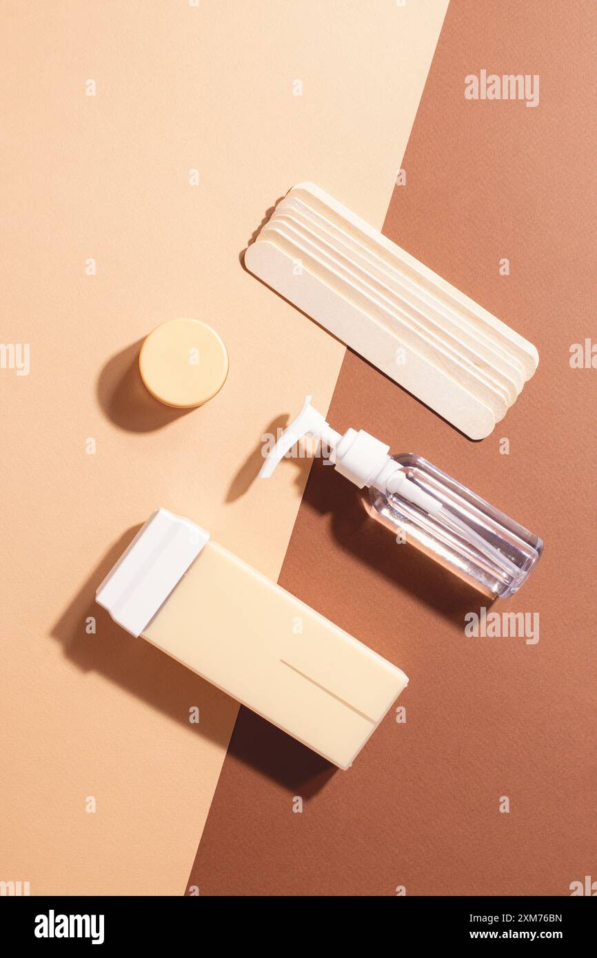 Top view of depilation tools on a beige brown background: cosmetology ...