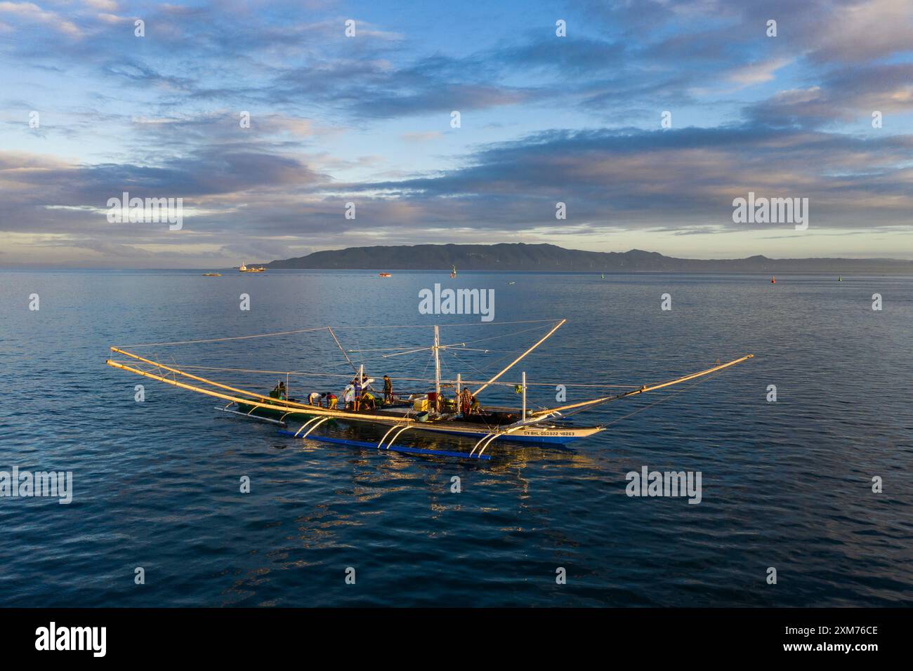 Aerial view of a traditional Bangka outrigger canoe fishing boat with ...