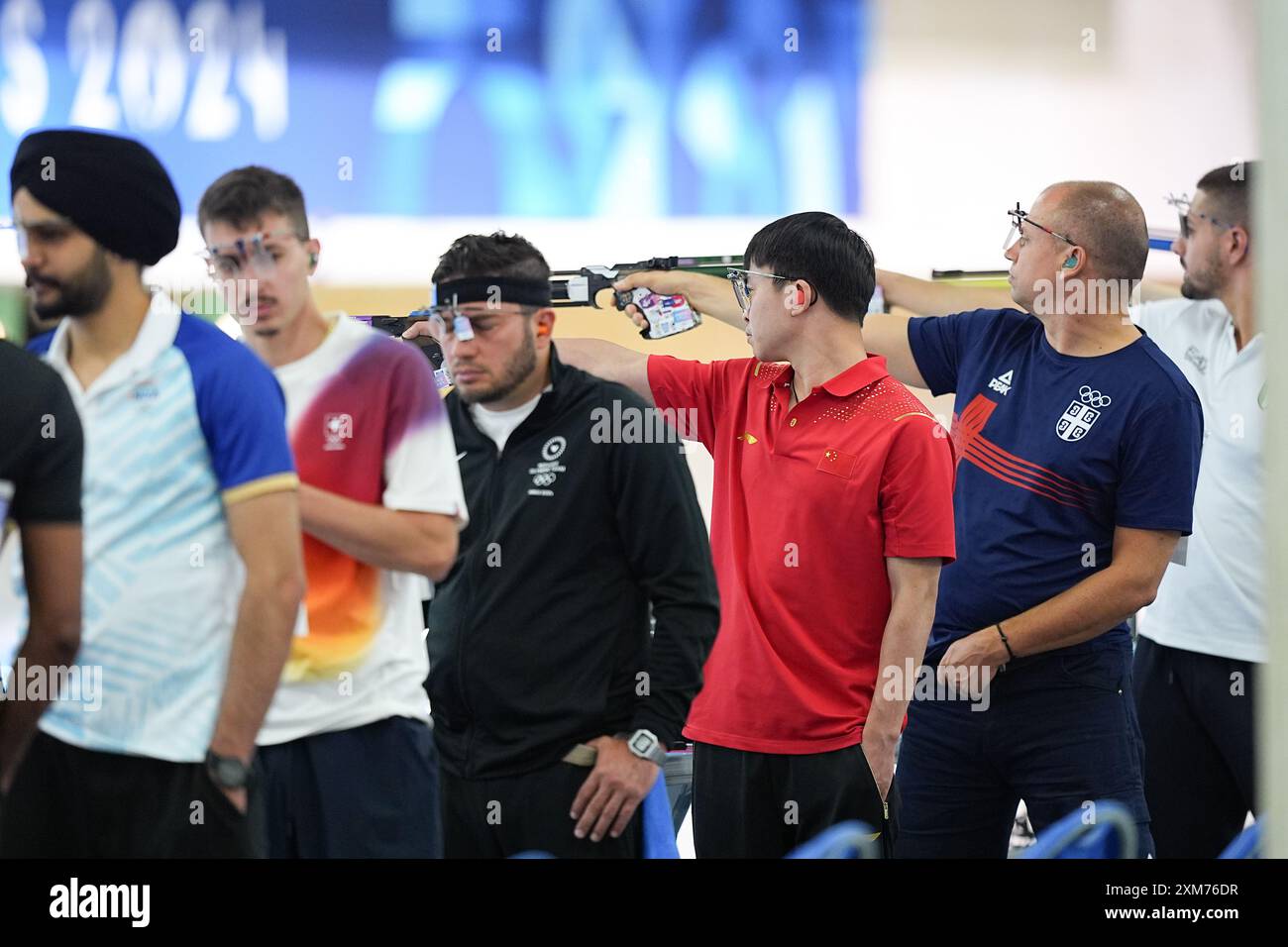 Chateauroux, France. 26th July, 2024. Xie Yu (3rd R) of China attends a ...