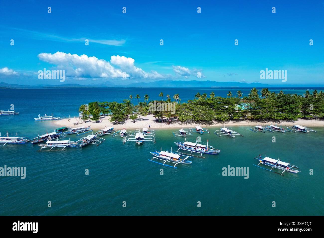 Aerial view of Bangka outrigger canoe tour boats on Cowrie Island ...
