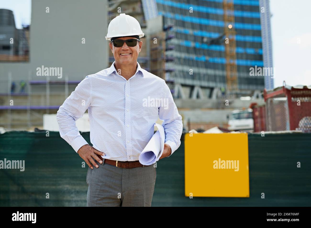 Construction site, portrait and mature man with blueprint for floor ...