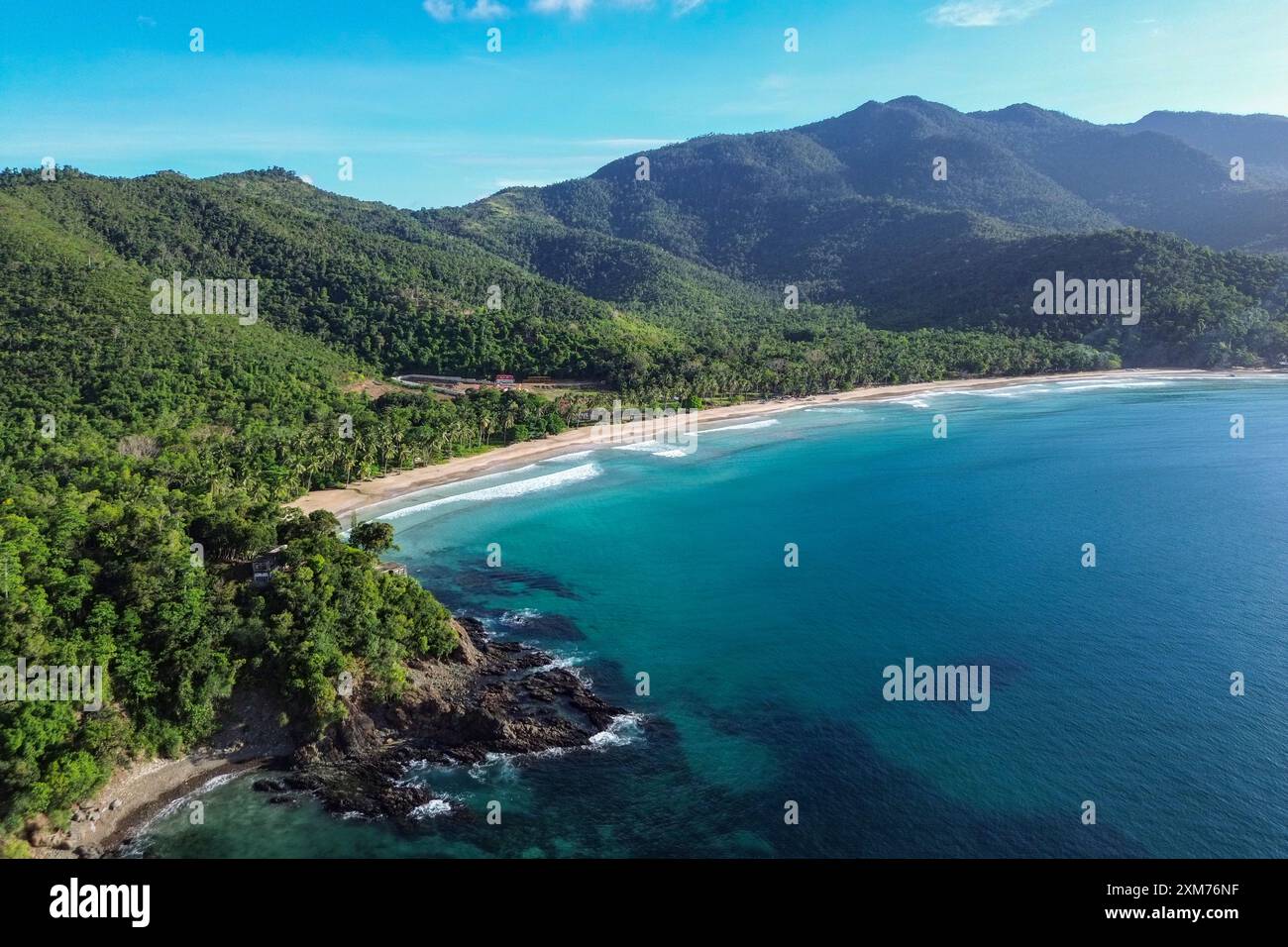 Aerial view of bay with Nagtabon Beach and mountains, Bacungan, near ...