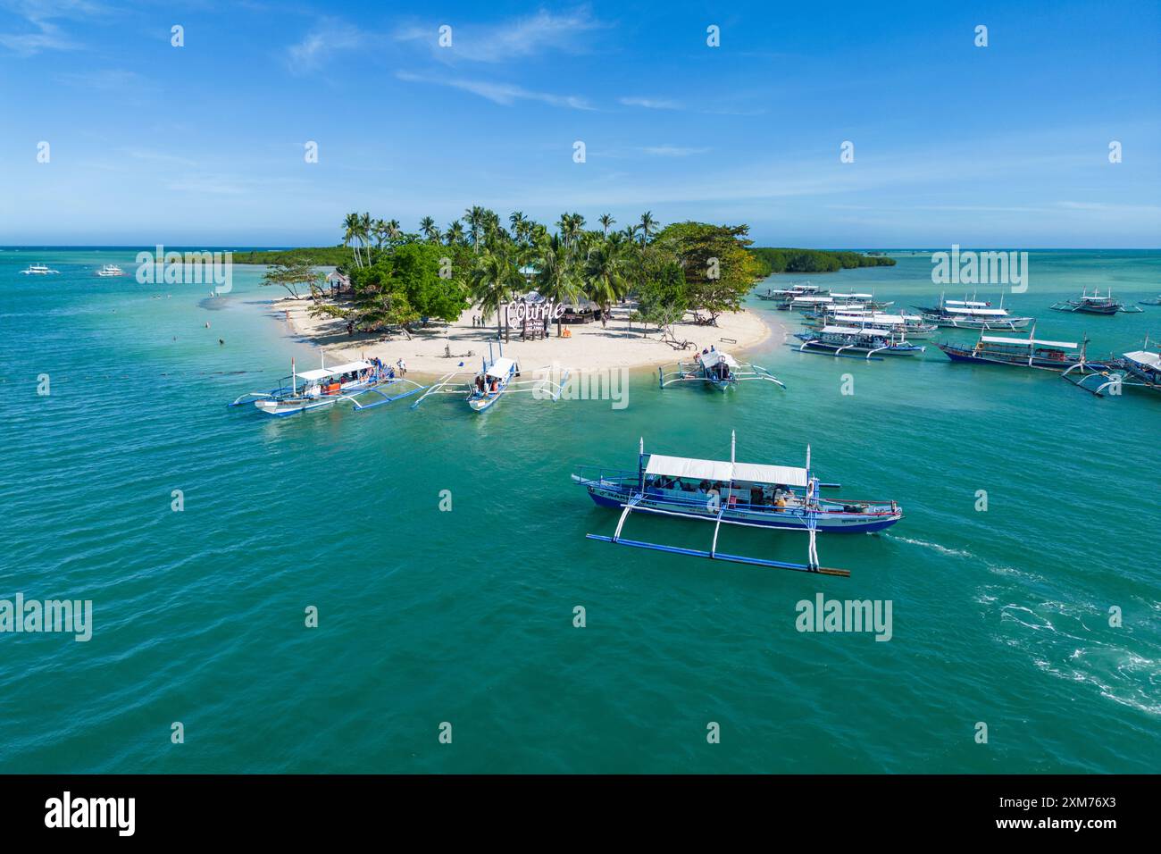Aerial photographs of Bangka outrigger canoe tour boats on Cowrie ...