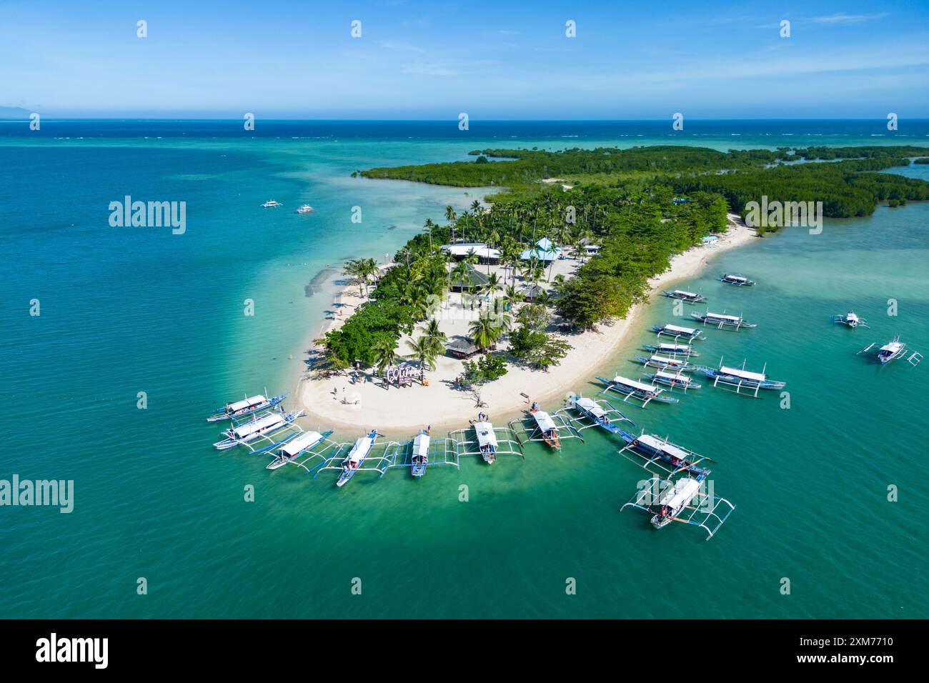 Aerial photographs of Bangka outrigger canoe tour boats on Cowrie ...