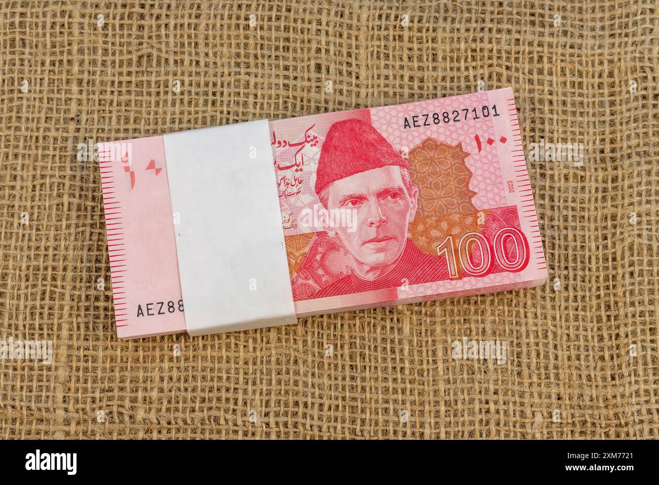 Stack of Pakistani 100 Rupee Banknotes on Burlap Background Stock Photo ...