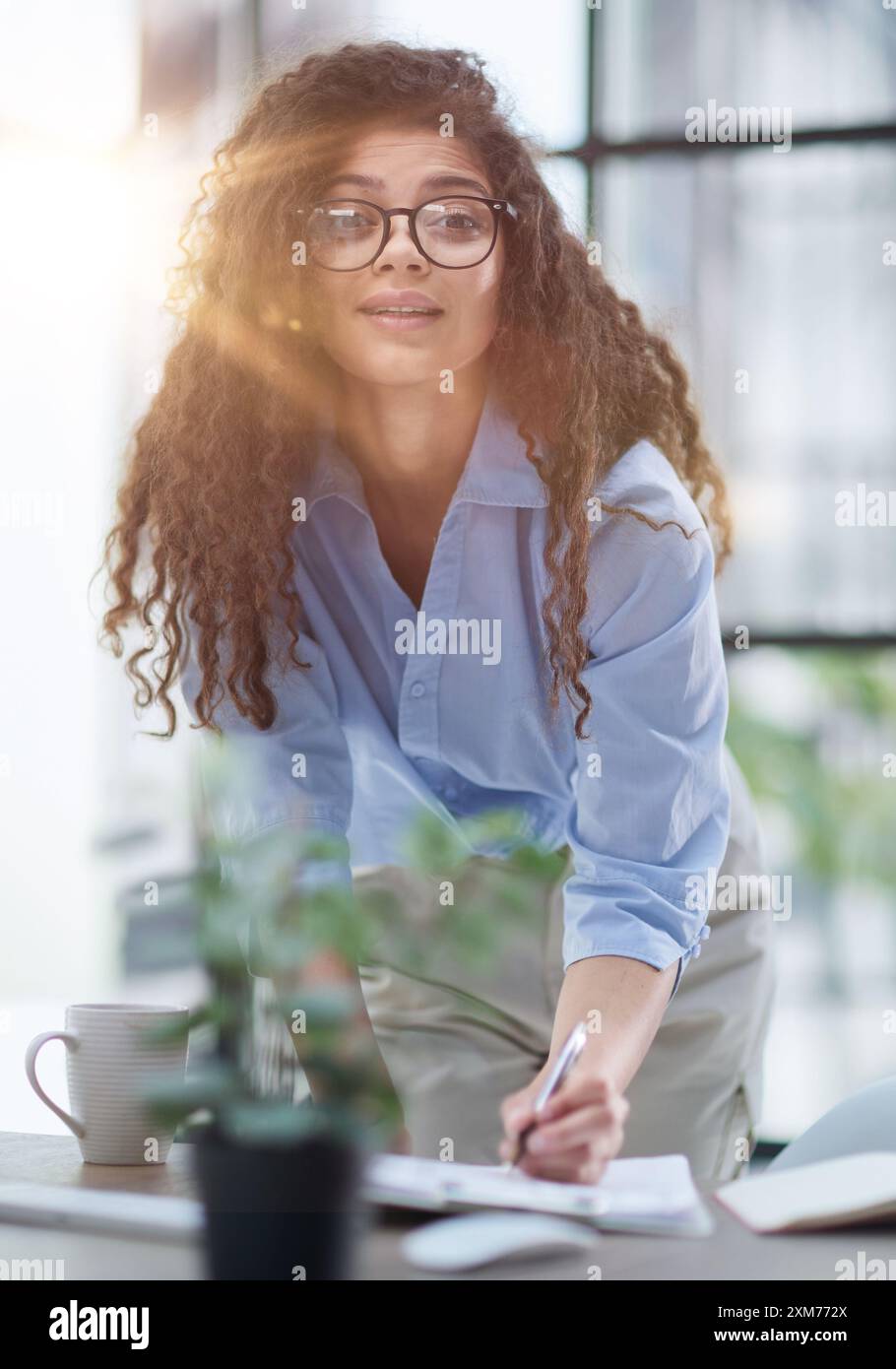 woman makes a report in the office. Woman writing notes for educational ...