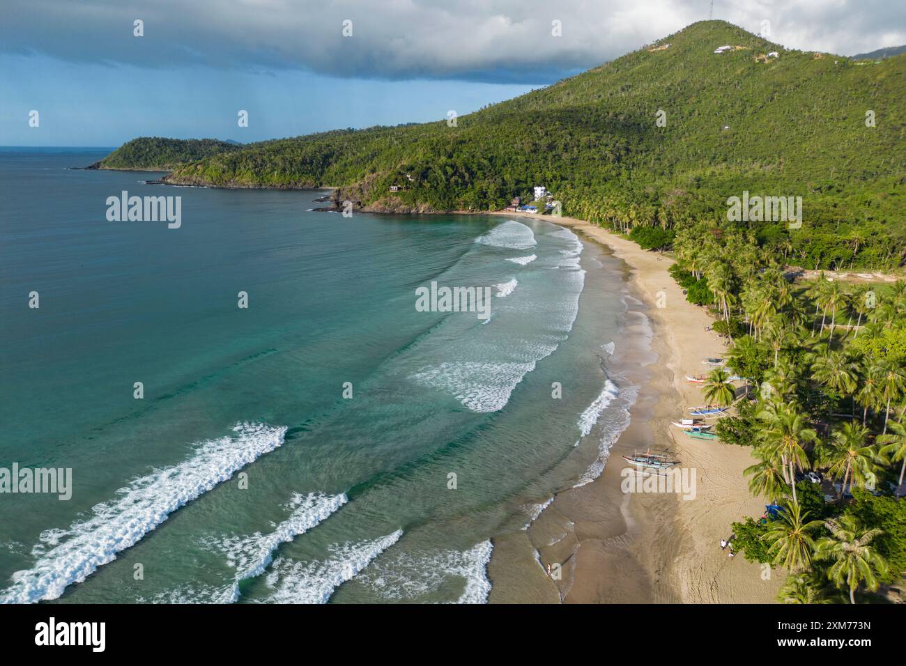 Aerial view of bay with Nagtabon Beach and mountains, Bacungan, near ...
