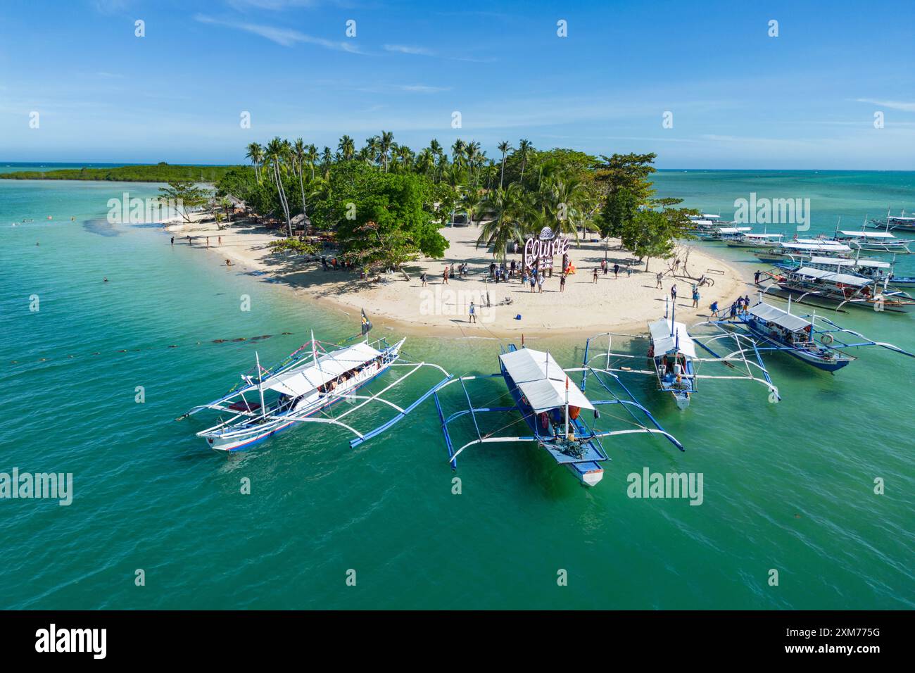 Aerial photographs of Bangka outrigger canoe tour boats on Cowrie ...
